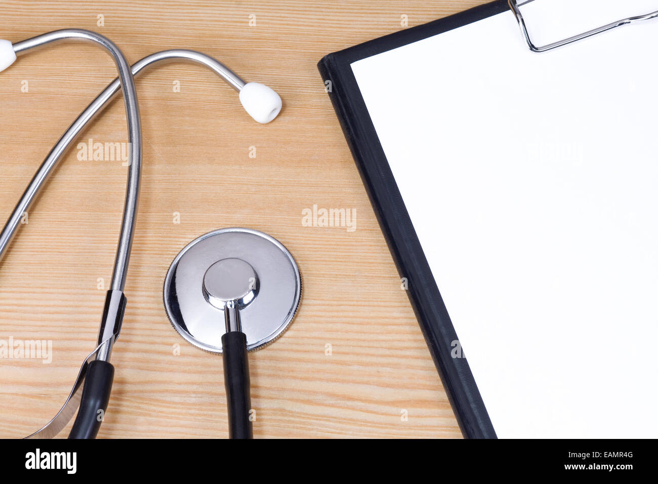 stethoscope and paper blank on table Stock Photo - Alamy