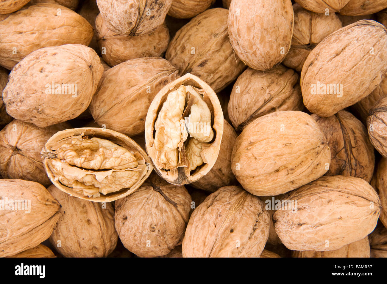 whole and hulled walnuts as background Stock Photo - Alamy