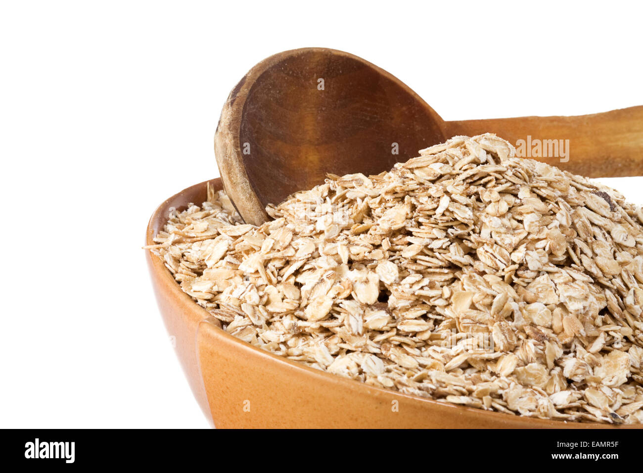oat flake and wood spoon in platespoon Stock Photo - Alamy