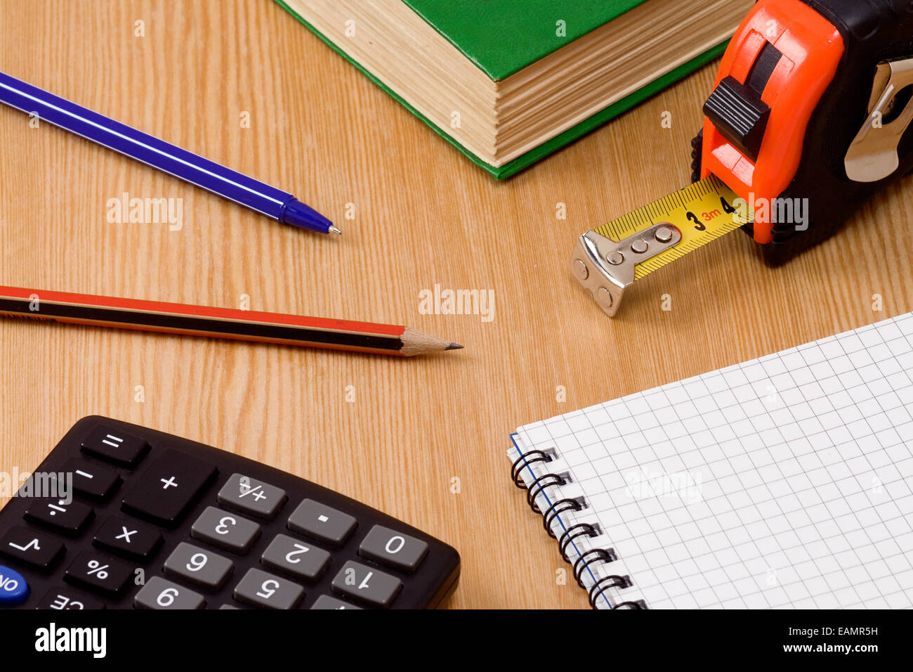 pen, pencil, tape measure and pad on textured table Stock Photo - Alamy