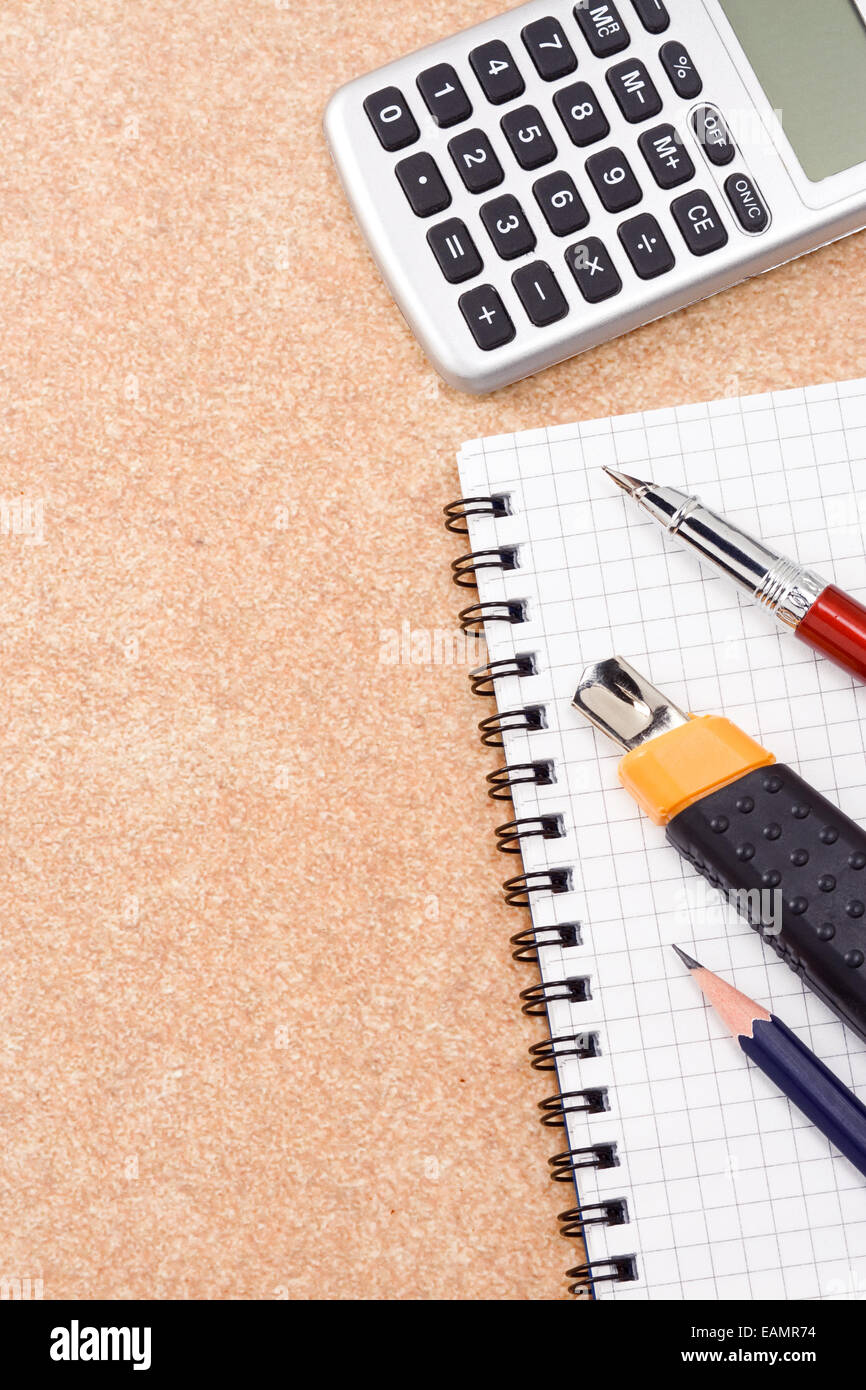 pens, paper knife and pencils on pad Stock Photo - Alamy