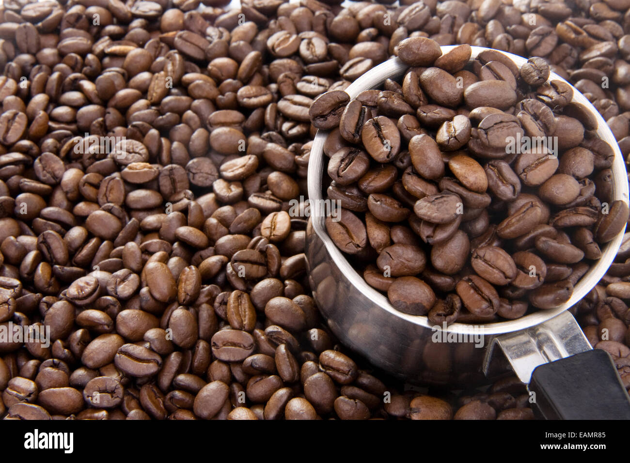 silver coffee pot on roasted beans Stock Photo - Alamy