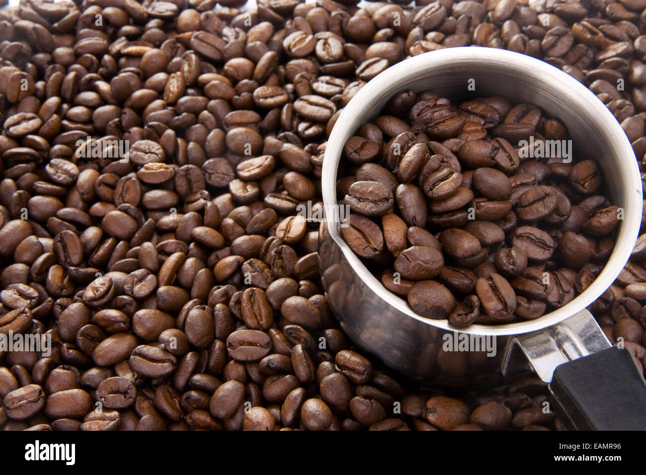 silver coffee pot on beans Stock Photo - Alamy