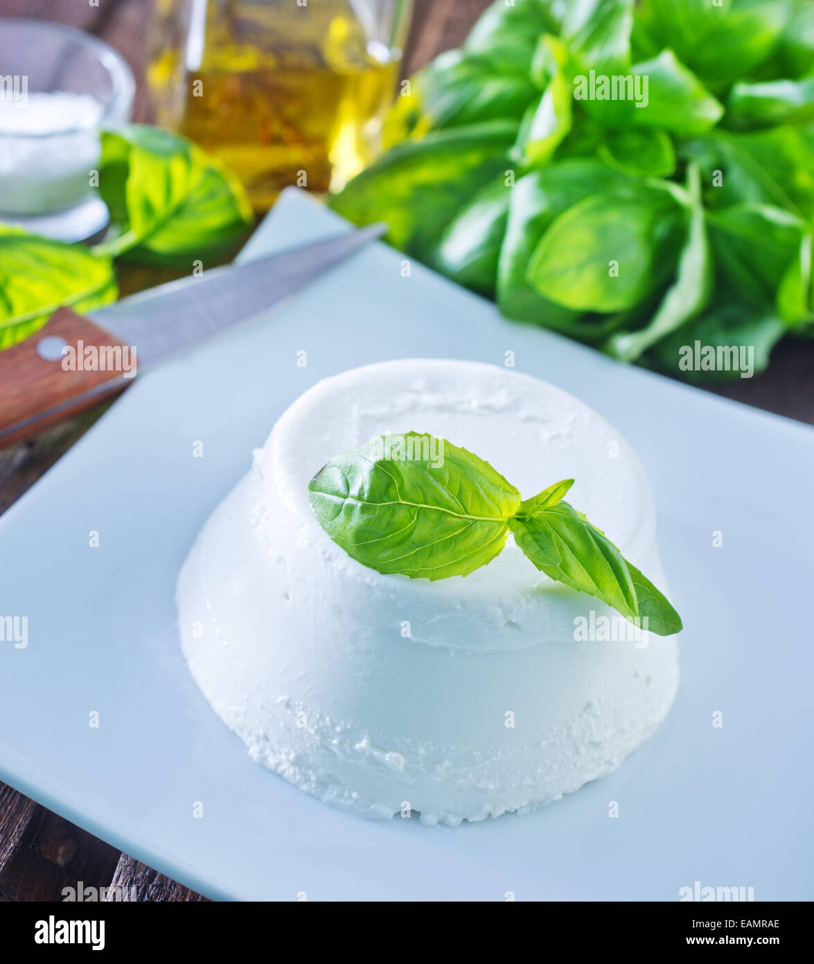 ricotta on the white plate and on a table Stock Photo - Alamy
