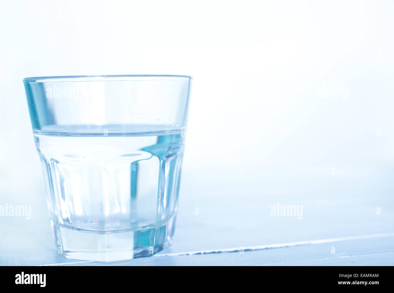 water in glass and on a table Stock Photo - Alamy
