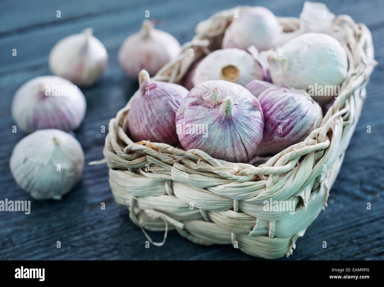 garlic in basket and on a table Stock Photo - Alamy