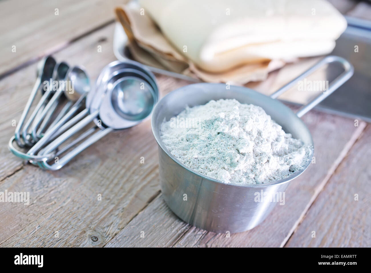 flour in metal bowl and on a table Stock Photo - Alamy