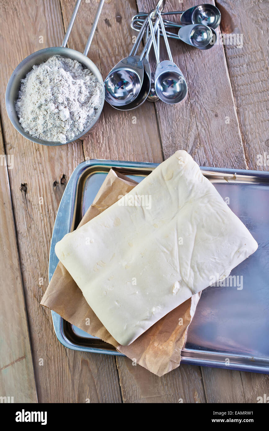 raw layer dough on metal tray and on a table Stock Photo - Alamy