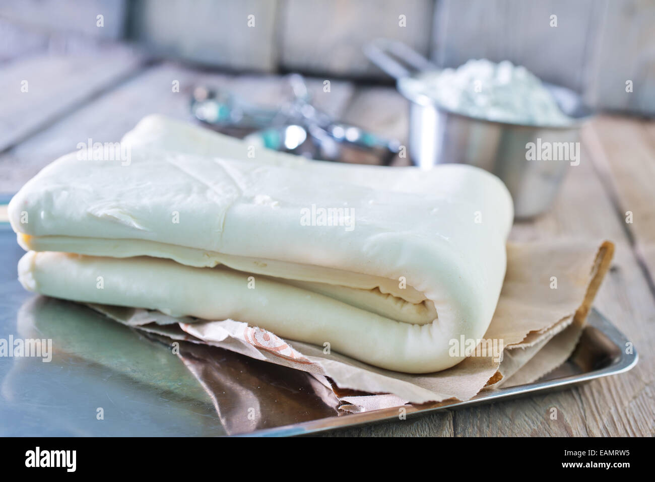 raw layer dough on metal tray and on a table Stock Photo - Alamy