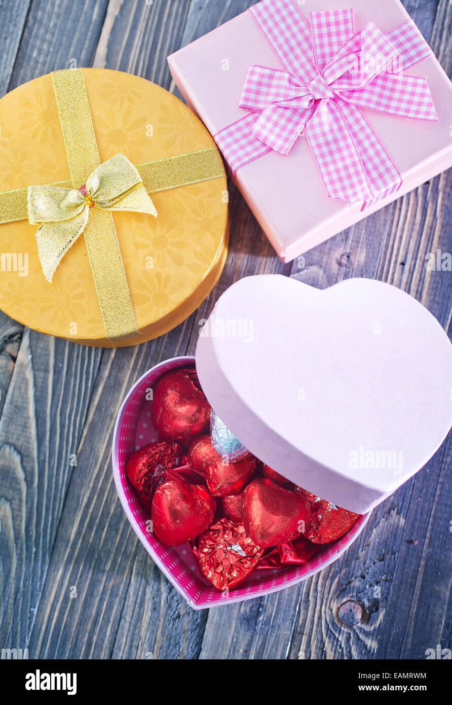 chocolate candy and box for present on a table Stock Photo - Alamy