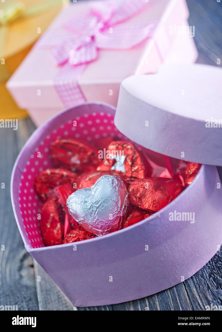 chocolate candy and box for present on a table Stock Photo - Alamy