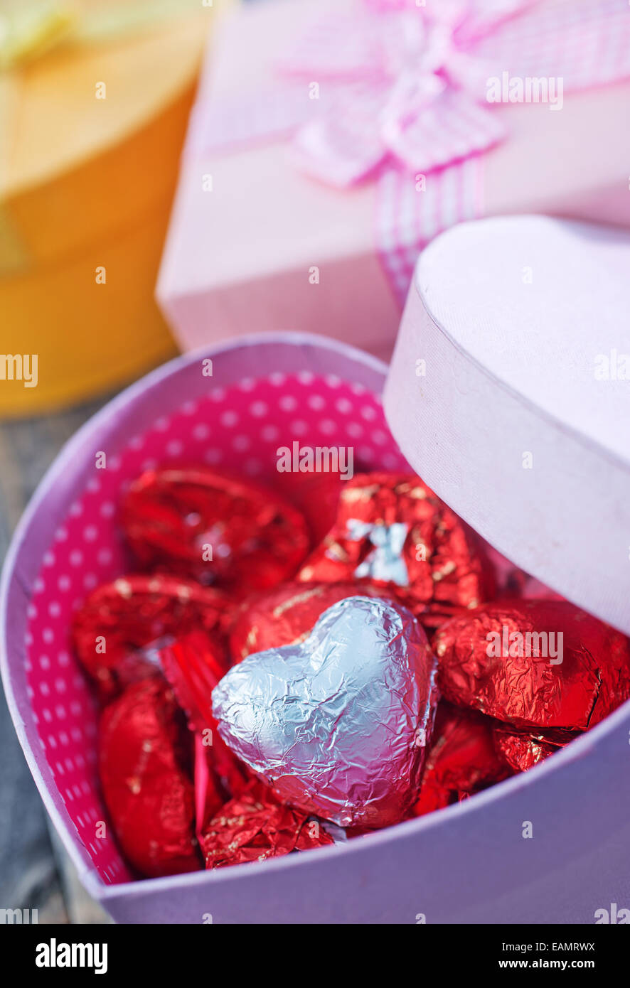 chocolate candy and box for present on a table Stock Photo - Alamy