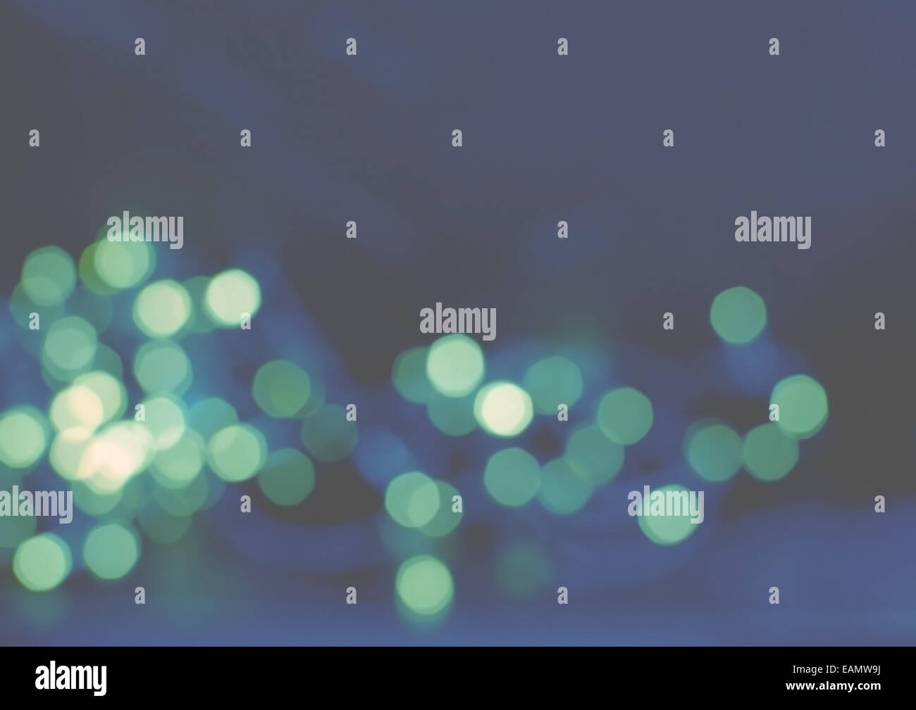Blue green light background. Background of light string toned in ...