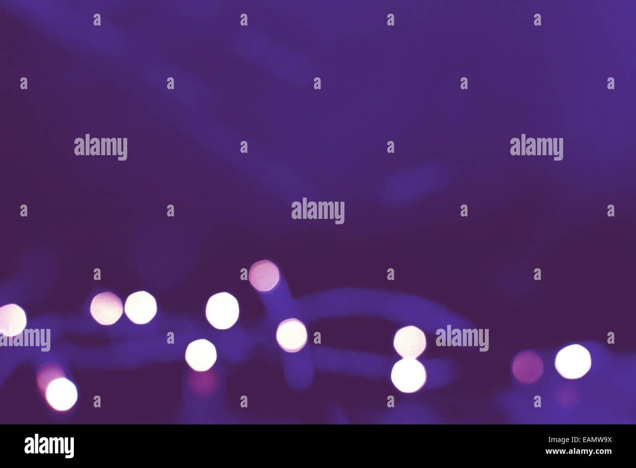 Purple light background. Background of light string toned in mystical ...