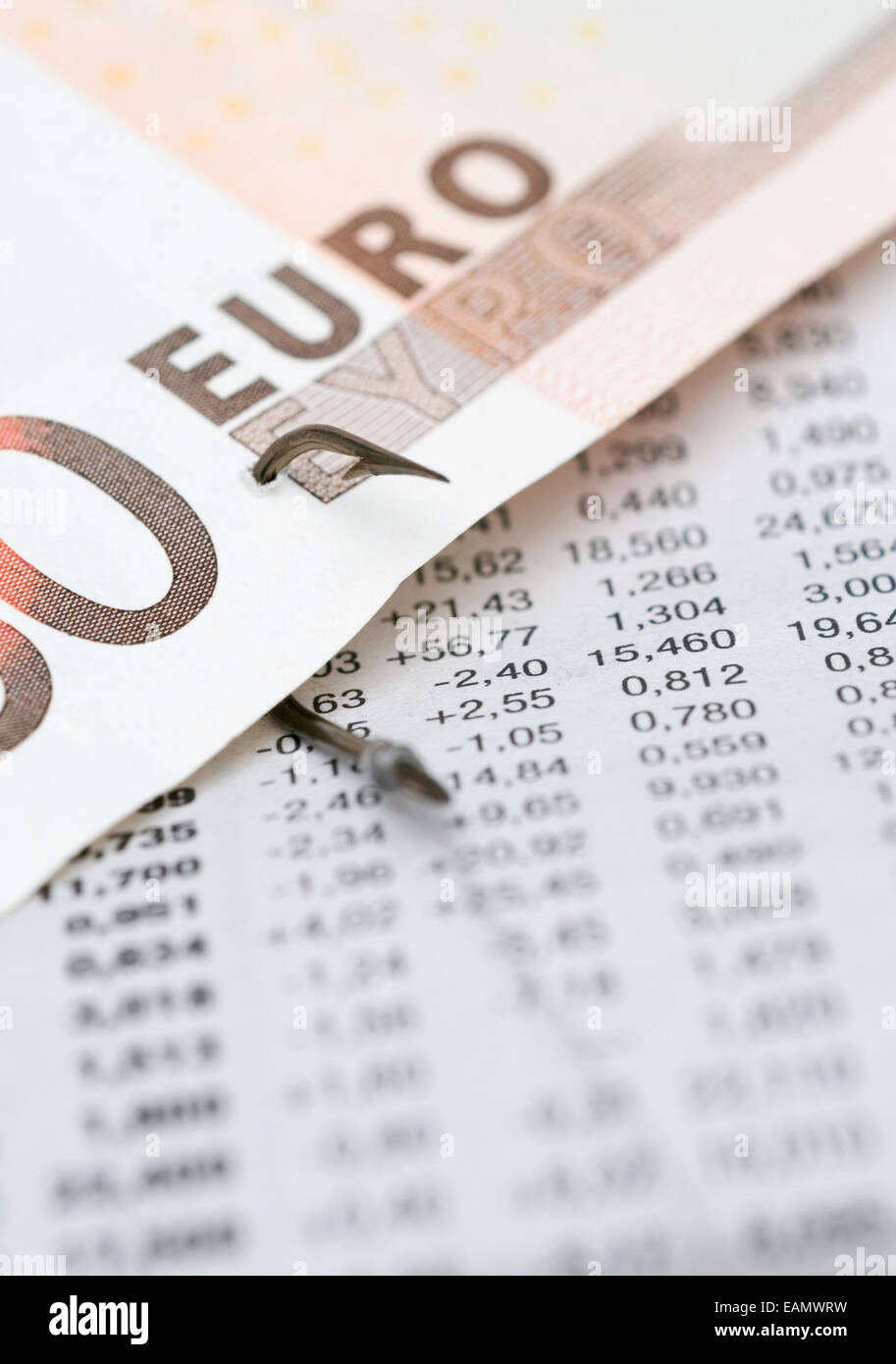 euro banknote hooked on a spreadsheet financial data print out Stock ...