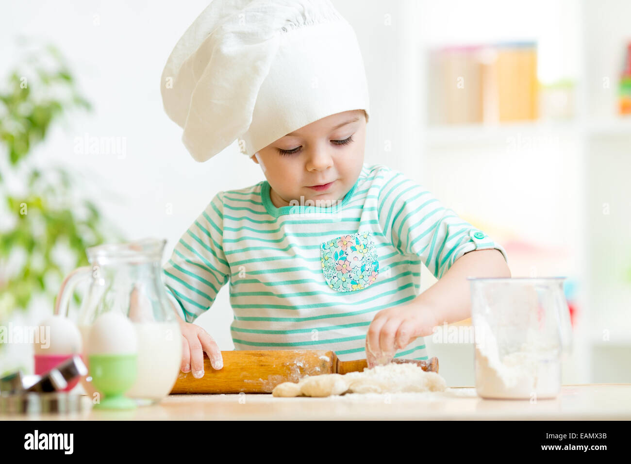 little baker kid girl in chef hat Stock Photo - Alamy