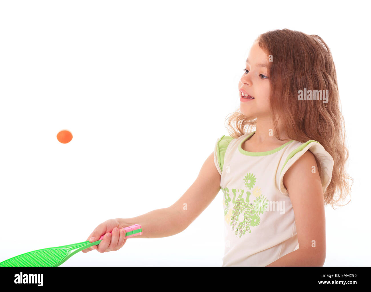 Beautiful little girl playing with a racket and a ball Stock Photo - Alamy