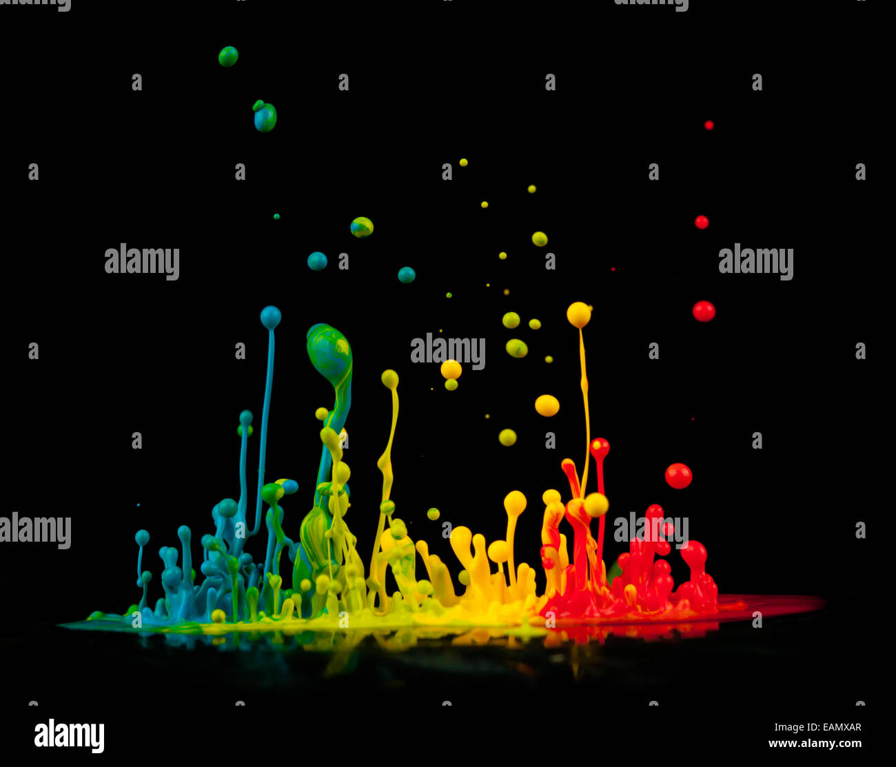 Colored splashes isolated on black background Stock Photo - Alamy