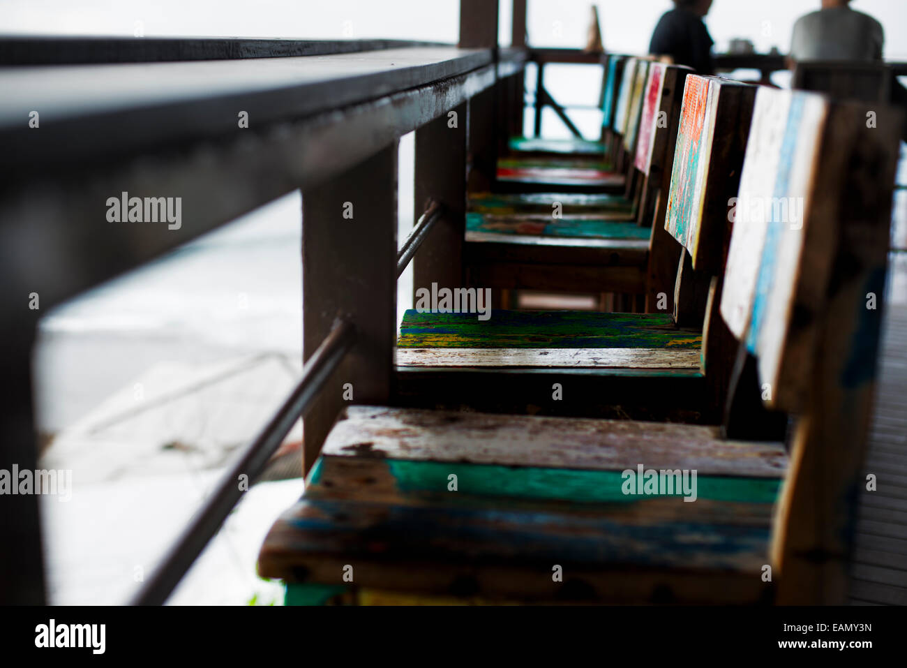 Row of chairs in a beach front restaurant Stock Photo - Alamy