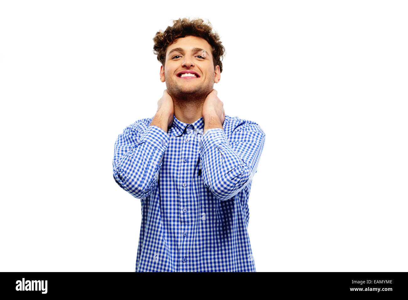 Happy relaxed man touching his neck over white background Stock Photo ...