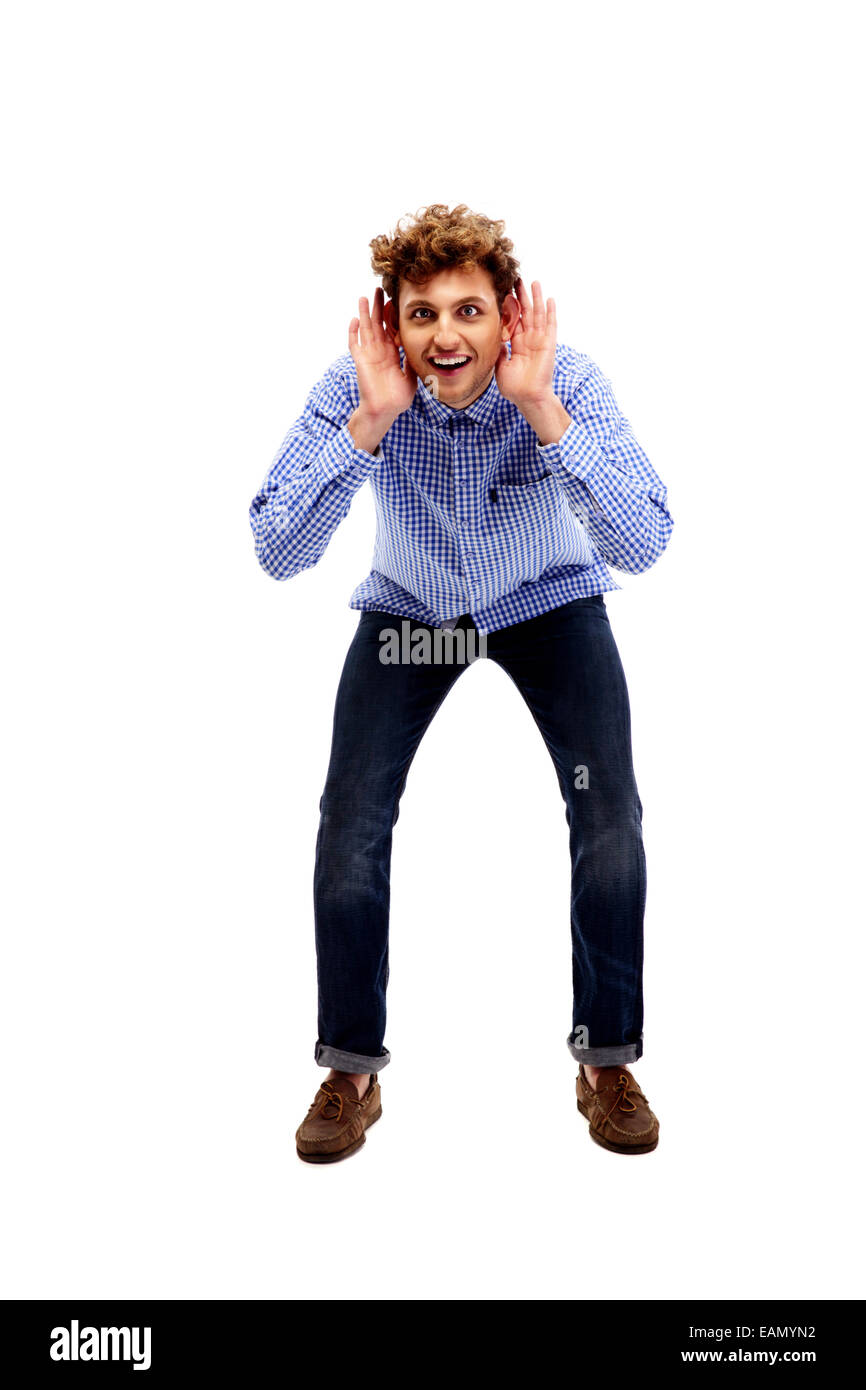 Full length portrait of a young man trying to hear something Stock ...