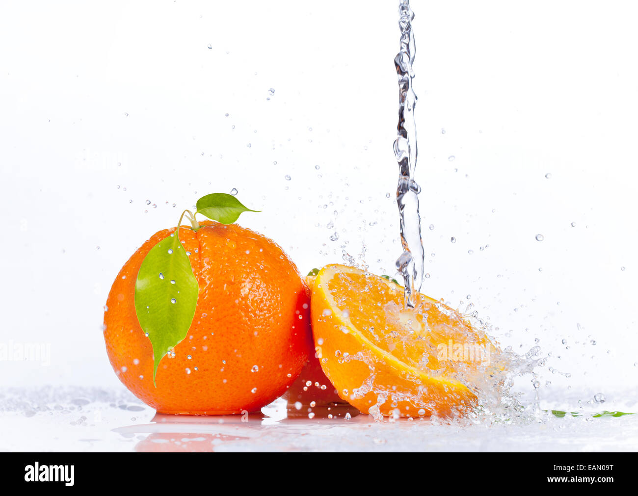 Fresh oranges with water splash, isolated on white background Stock ...