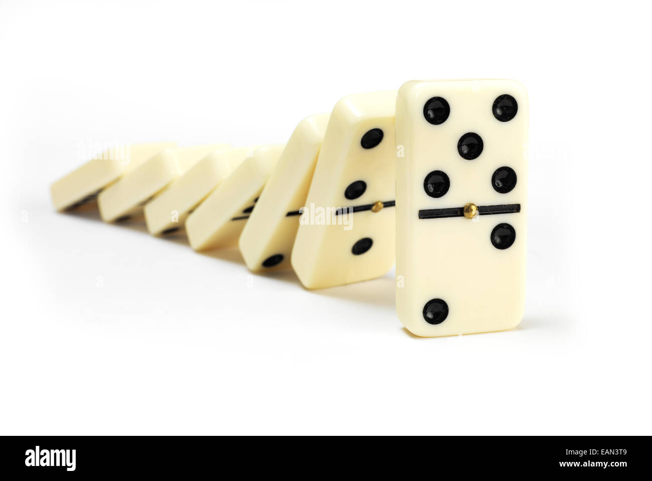 Line of Dominoes on white Stock Photo - Alamy