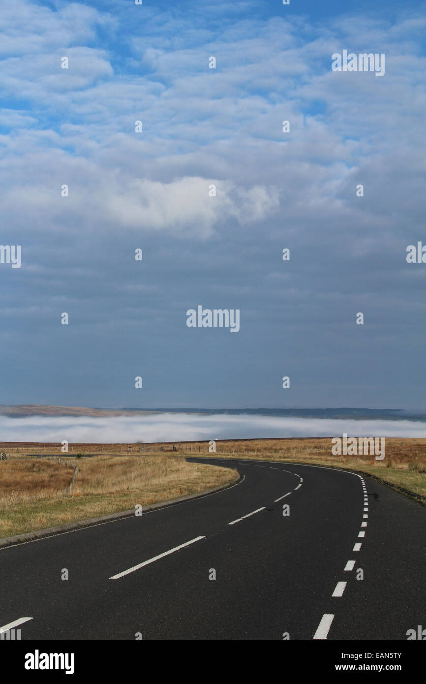 moorland road and temperature inversion Stock Photo - Alamy