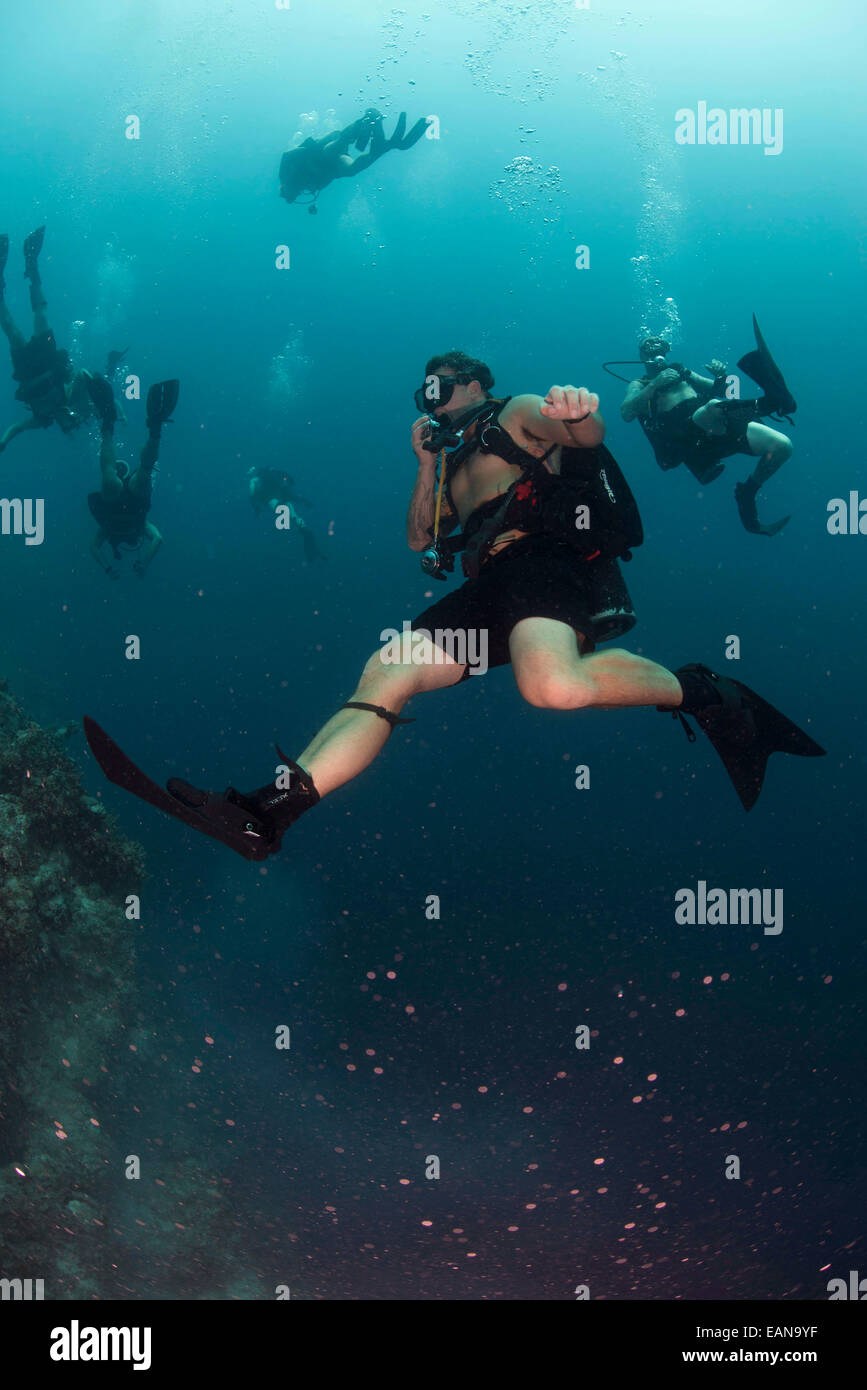 US Navy divers dive alongside Belize Coast Guard Service divers during ...