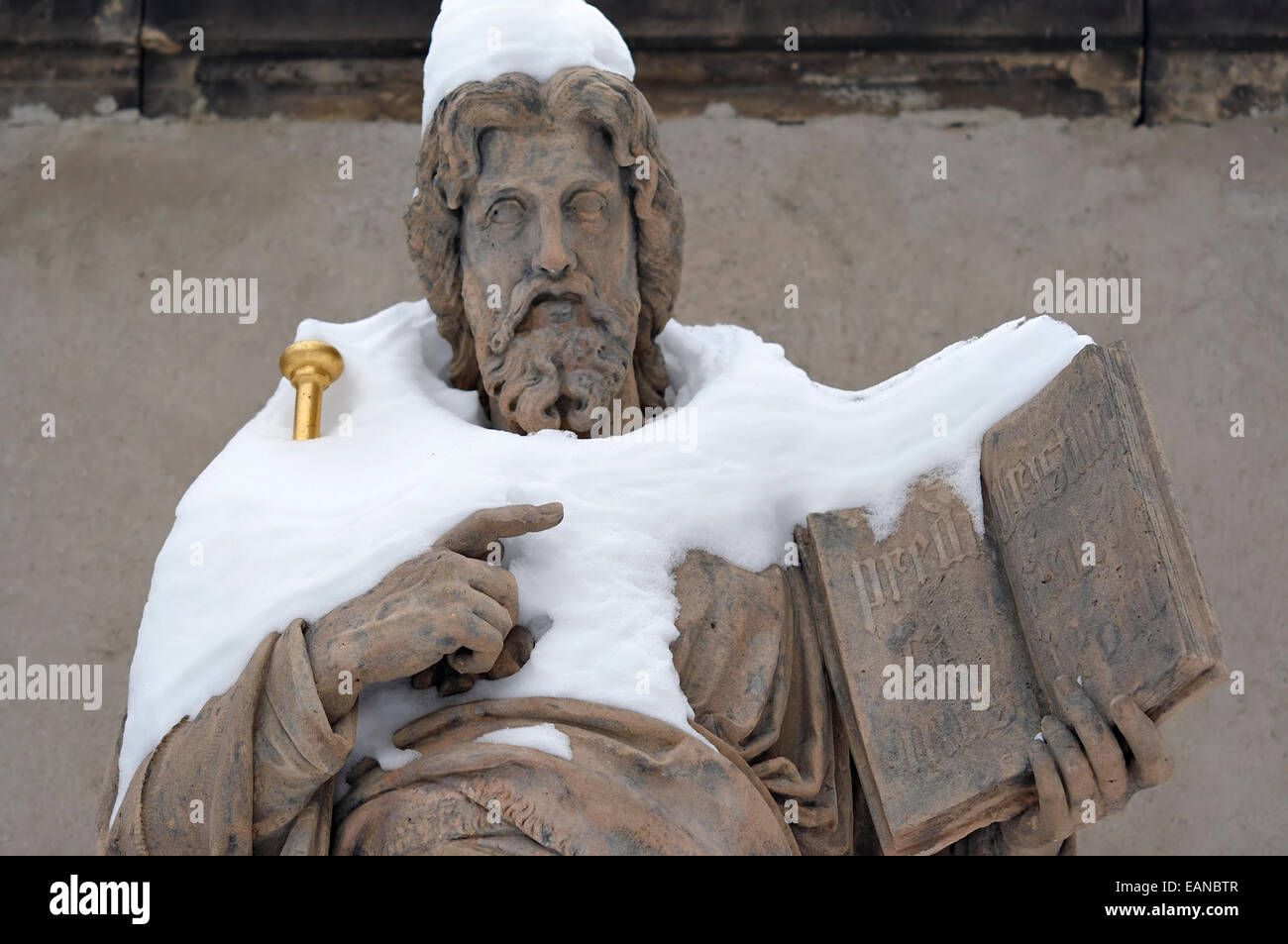 snowy statue of Saint Stock Photo - Alamy