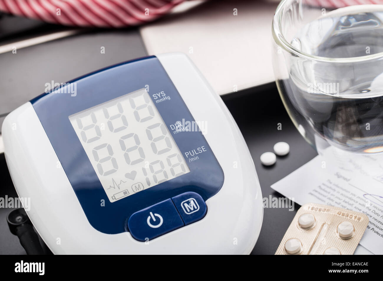 Checking blood pressure in office Stock Photo - Alamy