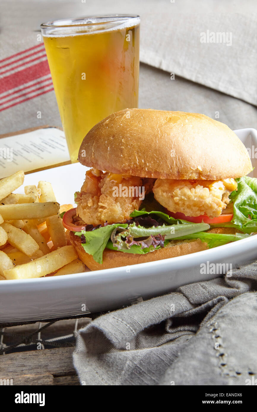 Shrimp Po Boy with french fries and beer Stock Photo - Alamy