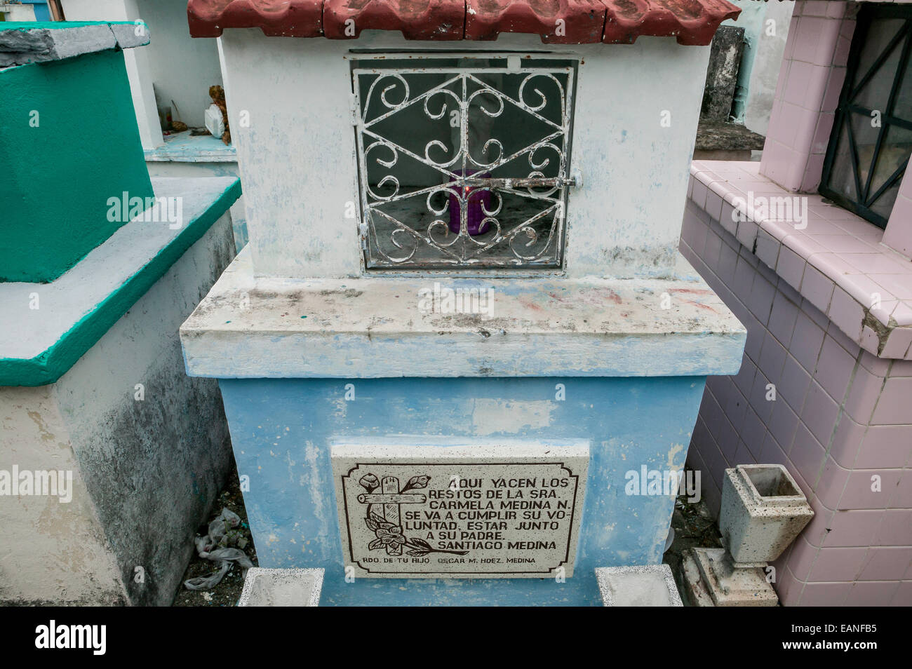 Blue painted Christian grave with grave lamp in the Champoton Cemetery ...