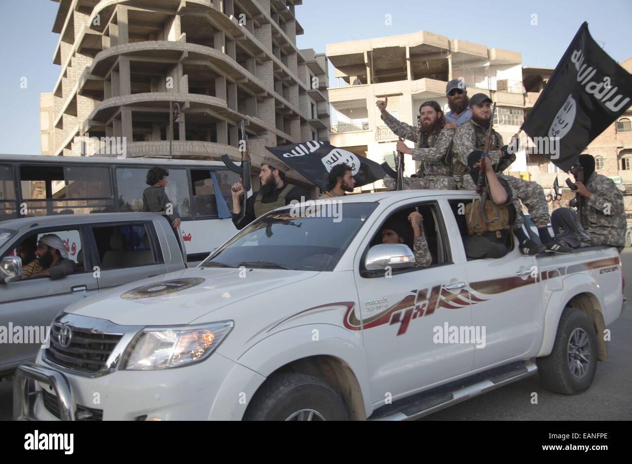 Jun 30, 2014 - Ar-Raqqa, Syria - Islamic State military parades through ...