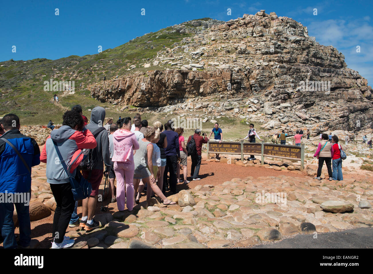 Tourists standing in a queue to take their pictures at the Cape of Good ...