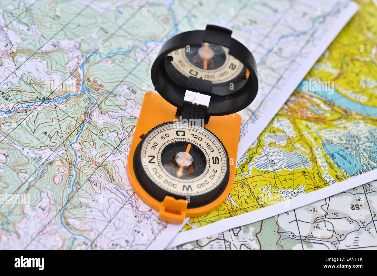 Compass, map, outdoor. The magnetic compass is located on the ...
