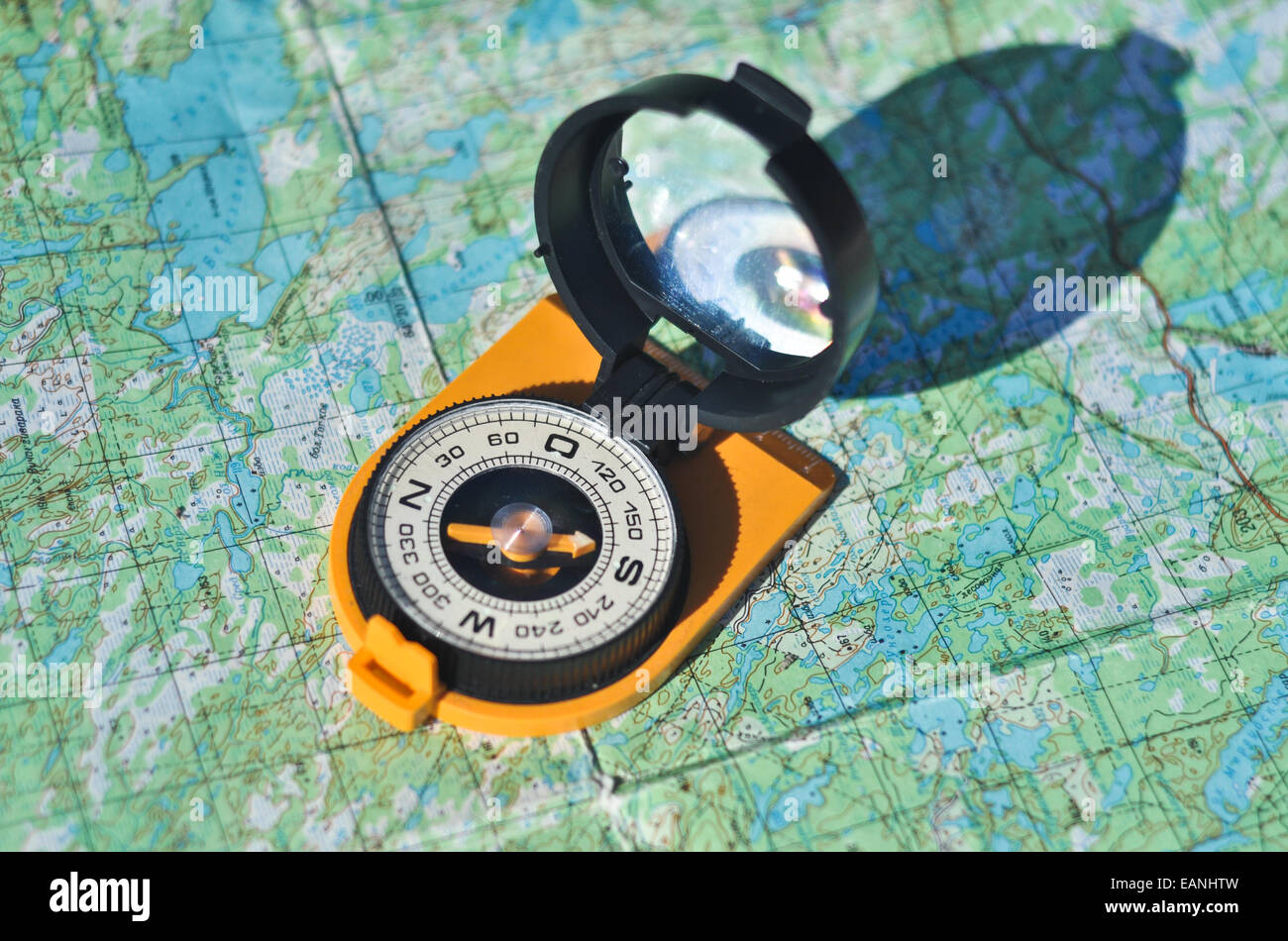 Compass, map, outdoor. The magnetic compass is located on the ...