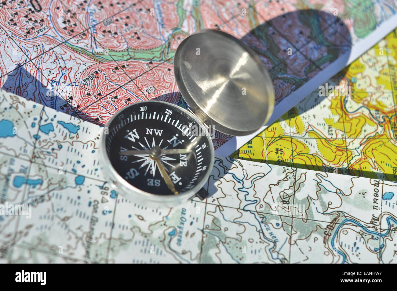 Map and compass. The magnetic compass is located on the topographic map ...