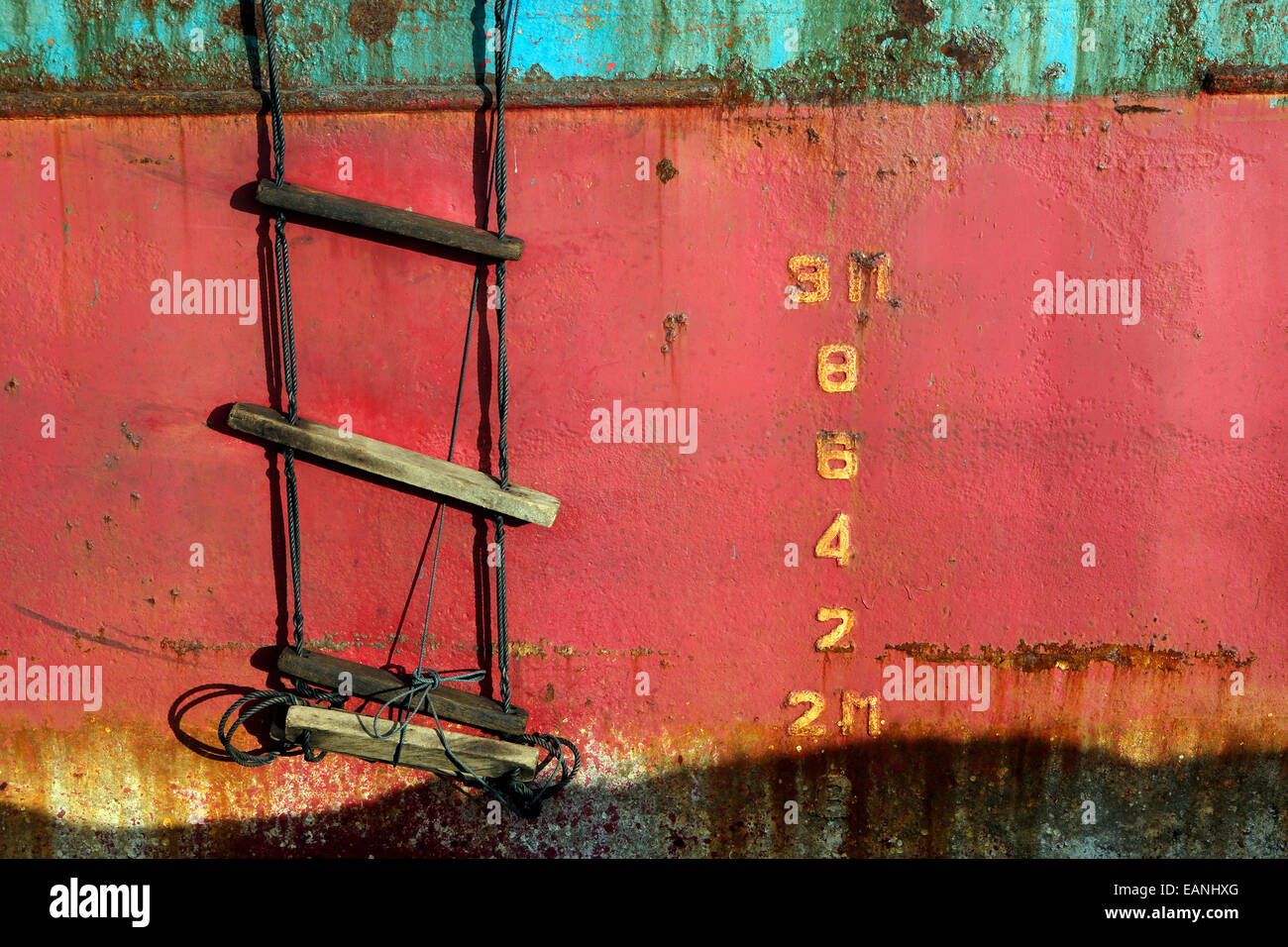 Depth markers on rusty hull of beached ship wreck Stock Photo - Alamy