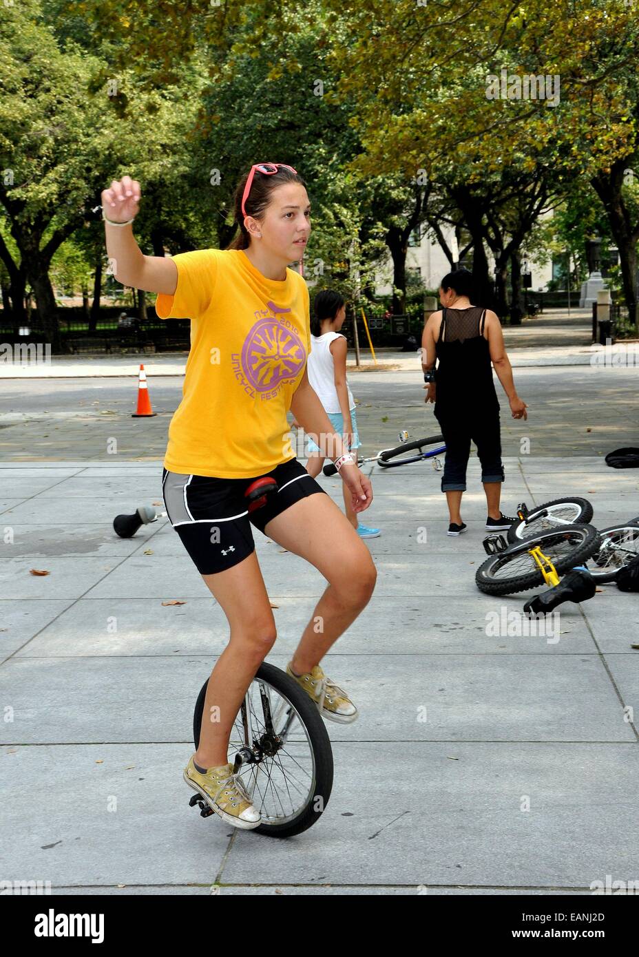 Woman riding a unicycle hi-res stock photography and images - Alamy