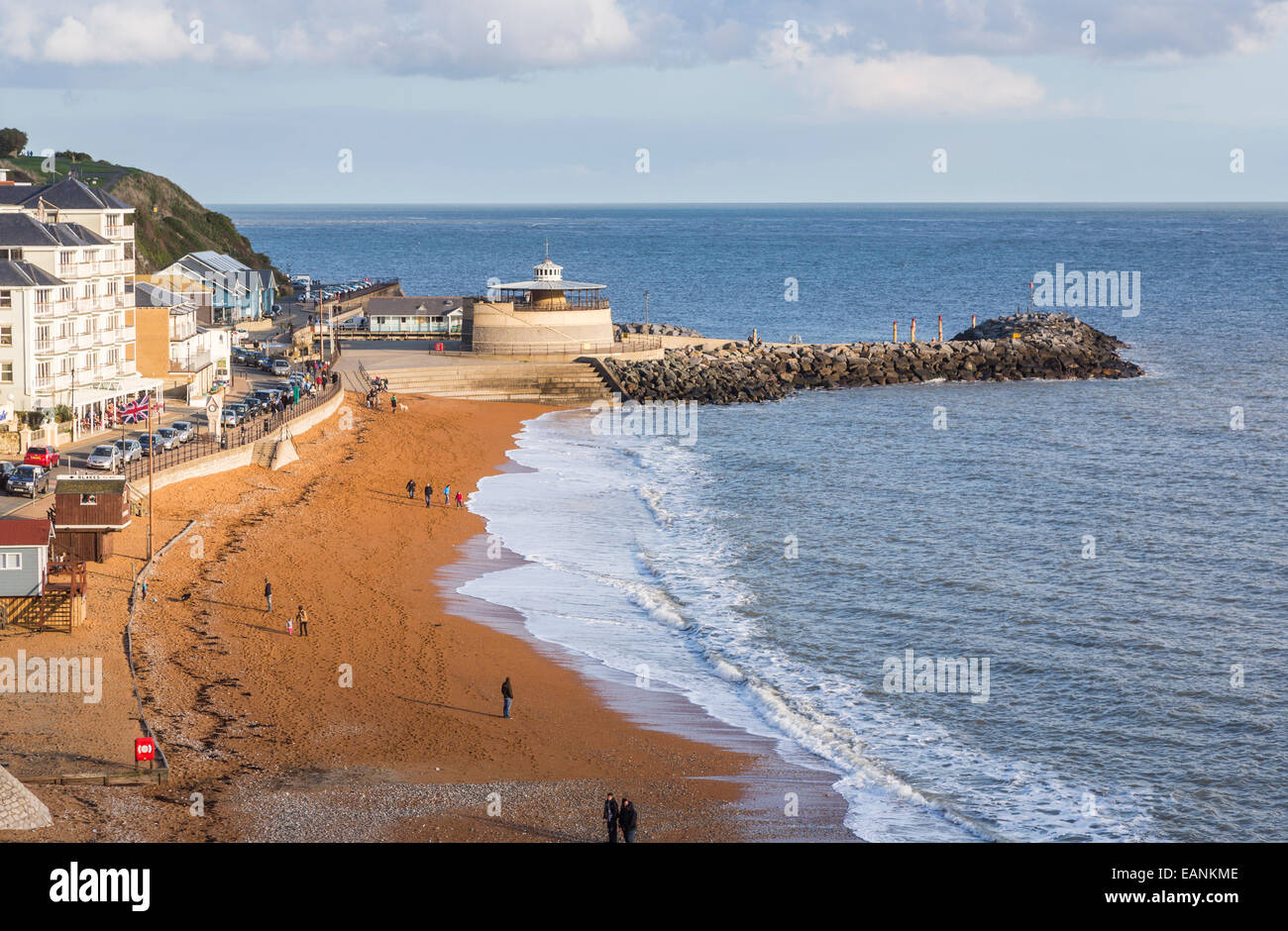 Seafront, promenade and sandy beach with gently breaking waves at ...