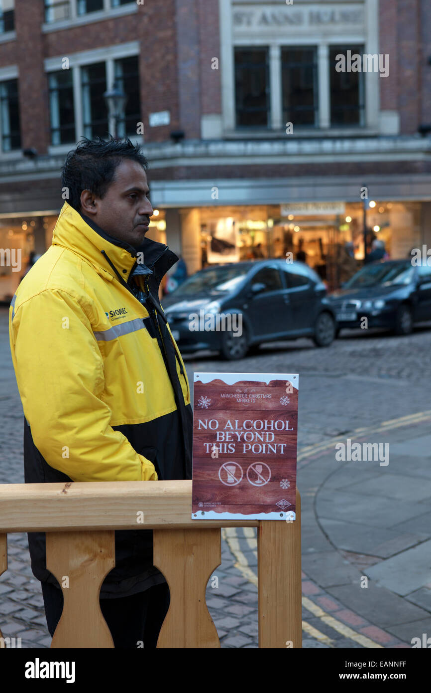 Security guard ensuring no alcohol enters the banned drinking street ...