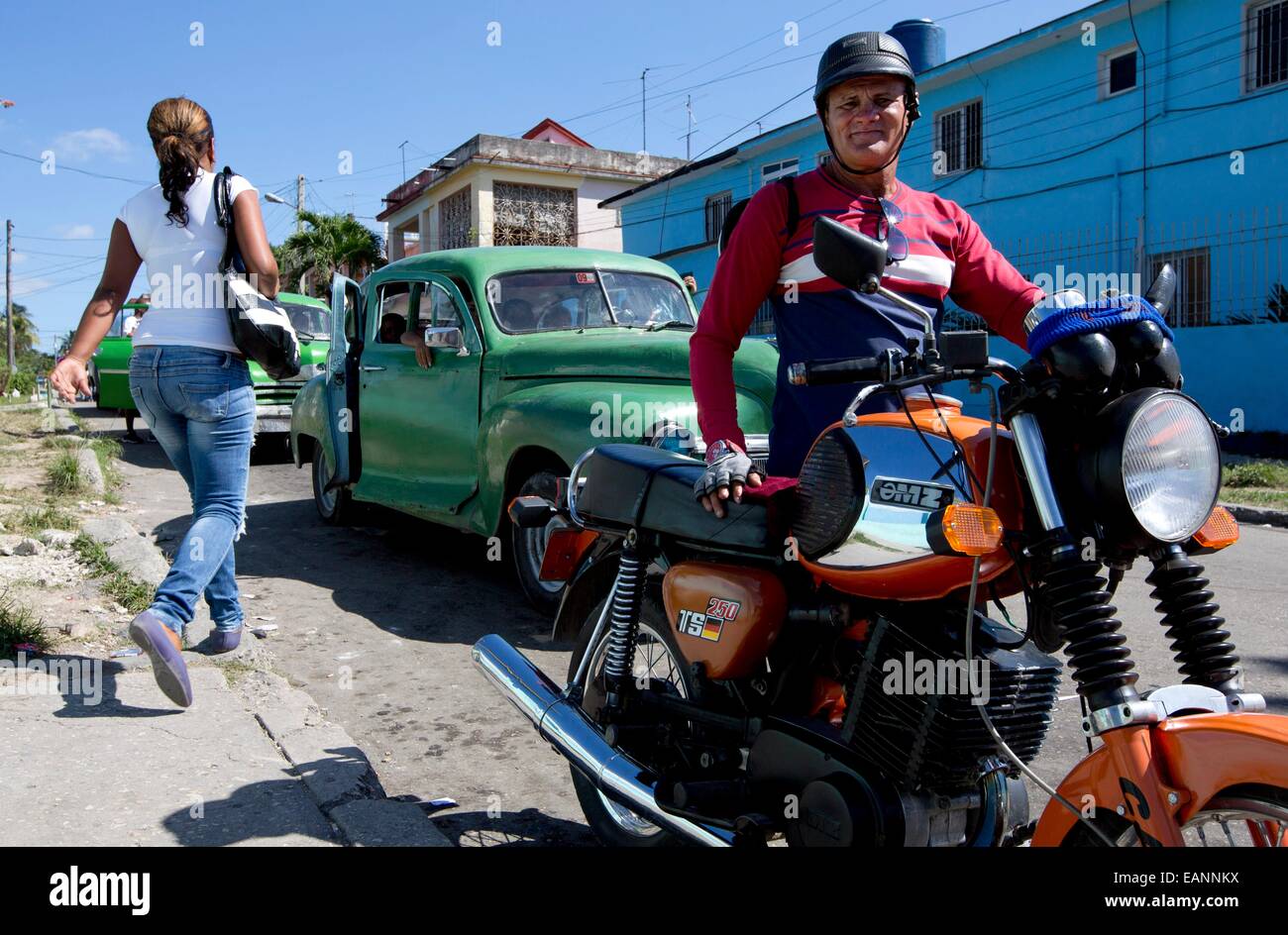 Havana, Cuba. 12th Nov, 2014. A taxi driver with his MZ motorcycle in ...