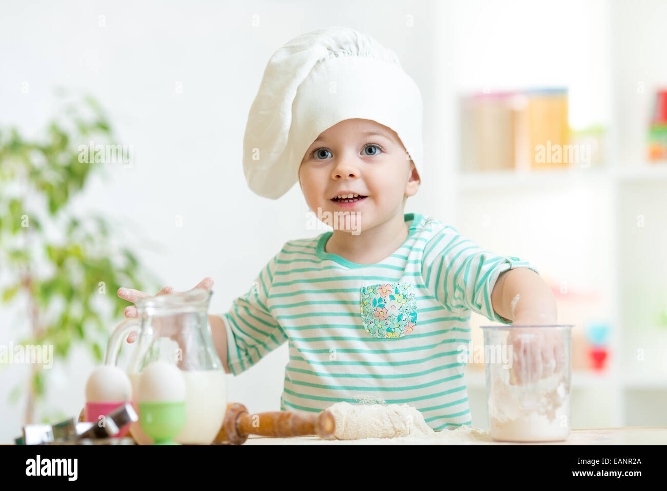little baker kid girl in chef hat Stock Photo - Alamy