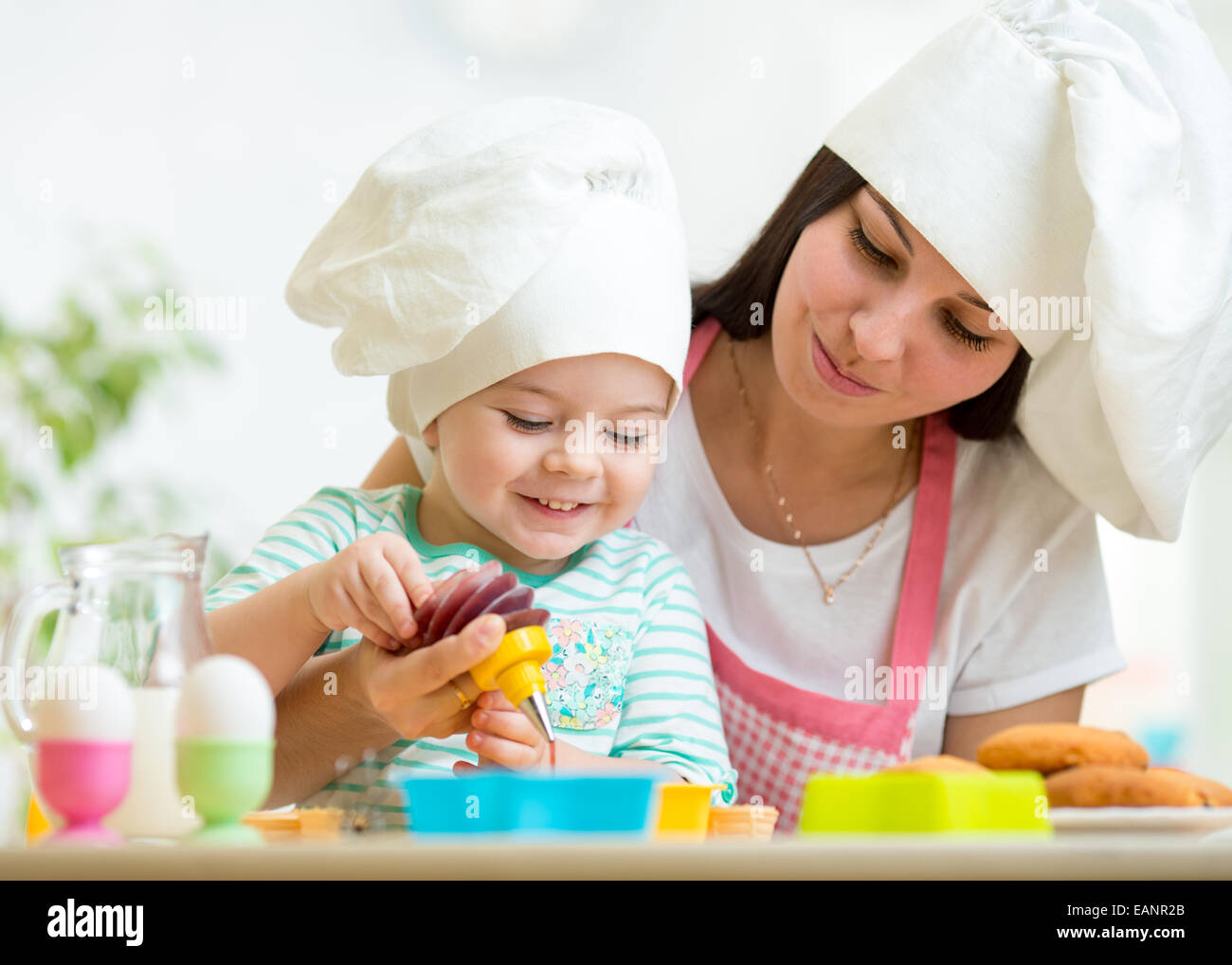 Mother and kid girl making cookies Stock Photo - Alamy
