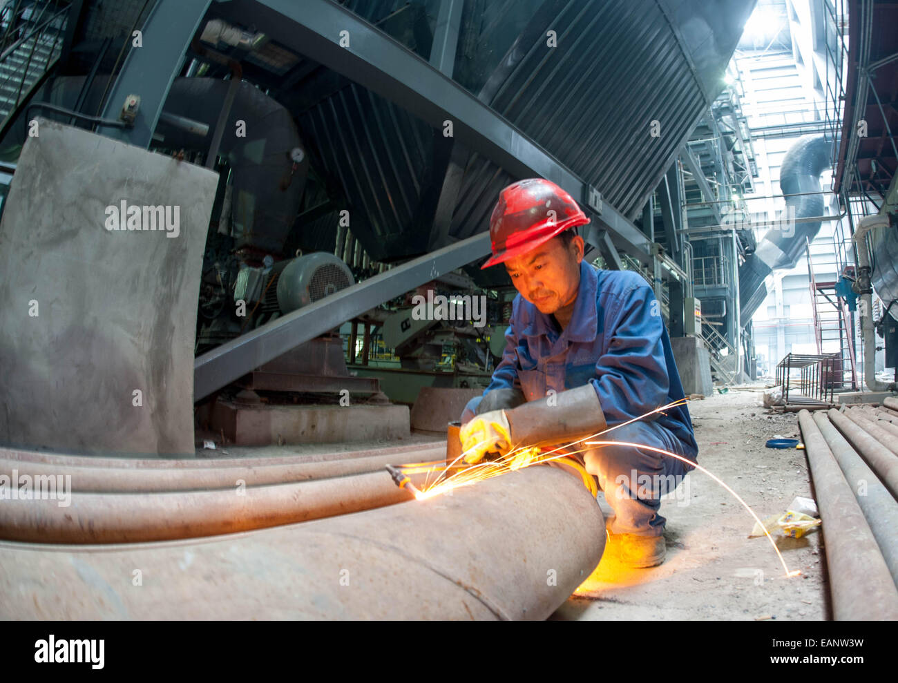 Chongqing, China. 18th Nov, 2014. A welder works at Wanzhou garbage ...