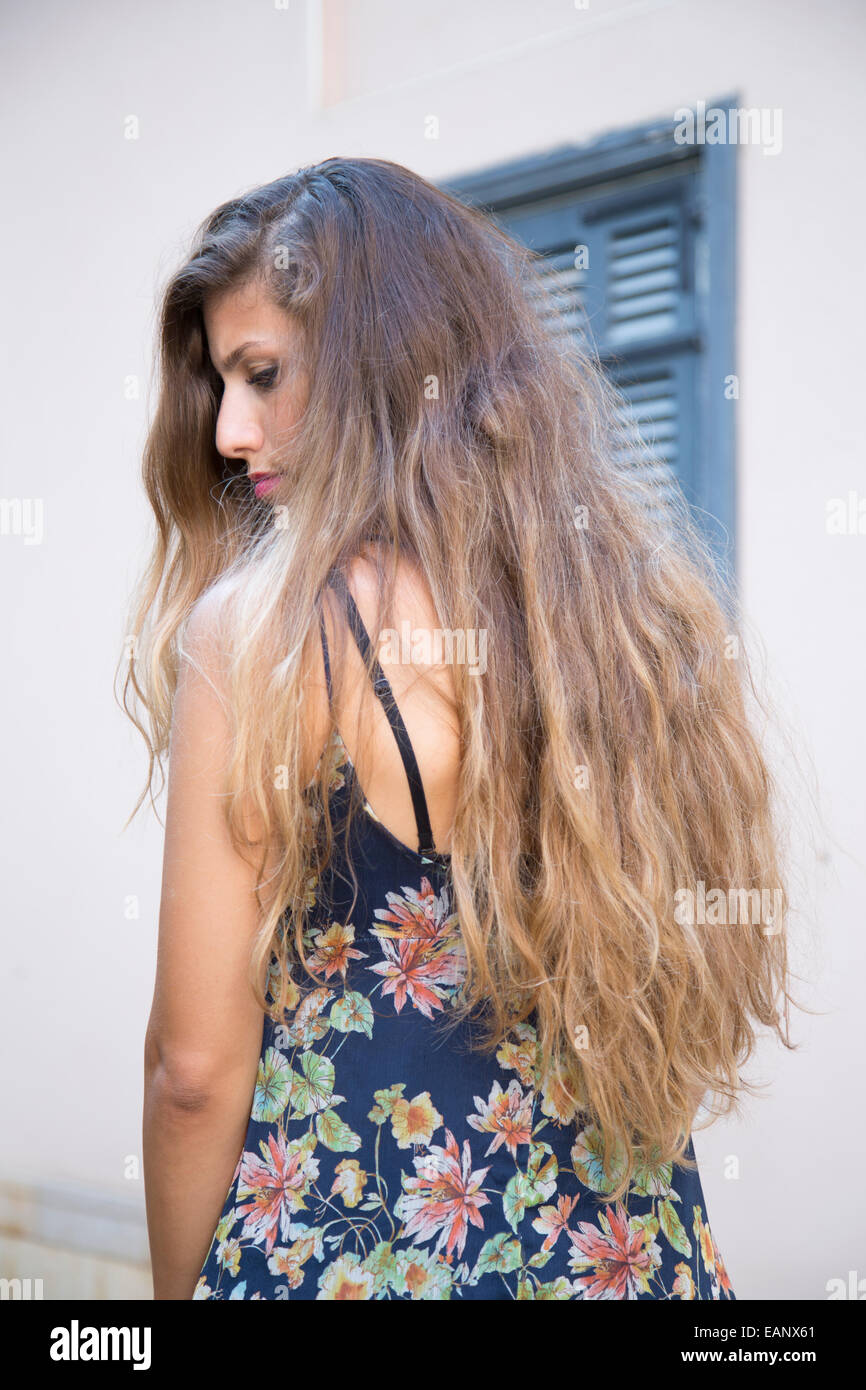 Girl looking back over shoulder hi-res stock photography and images - Alamy