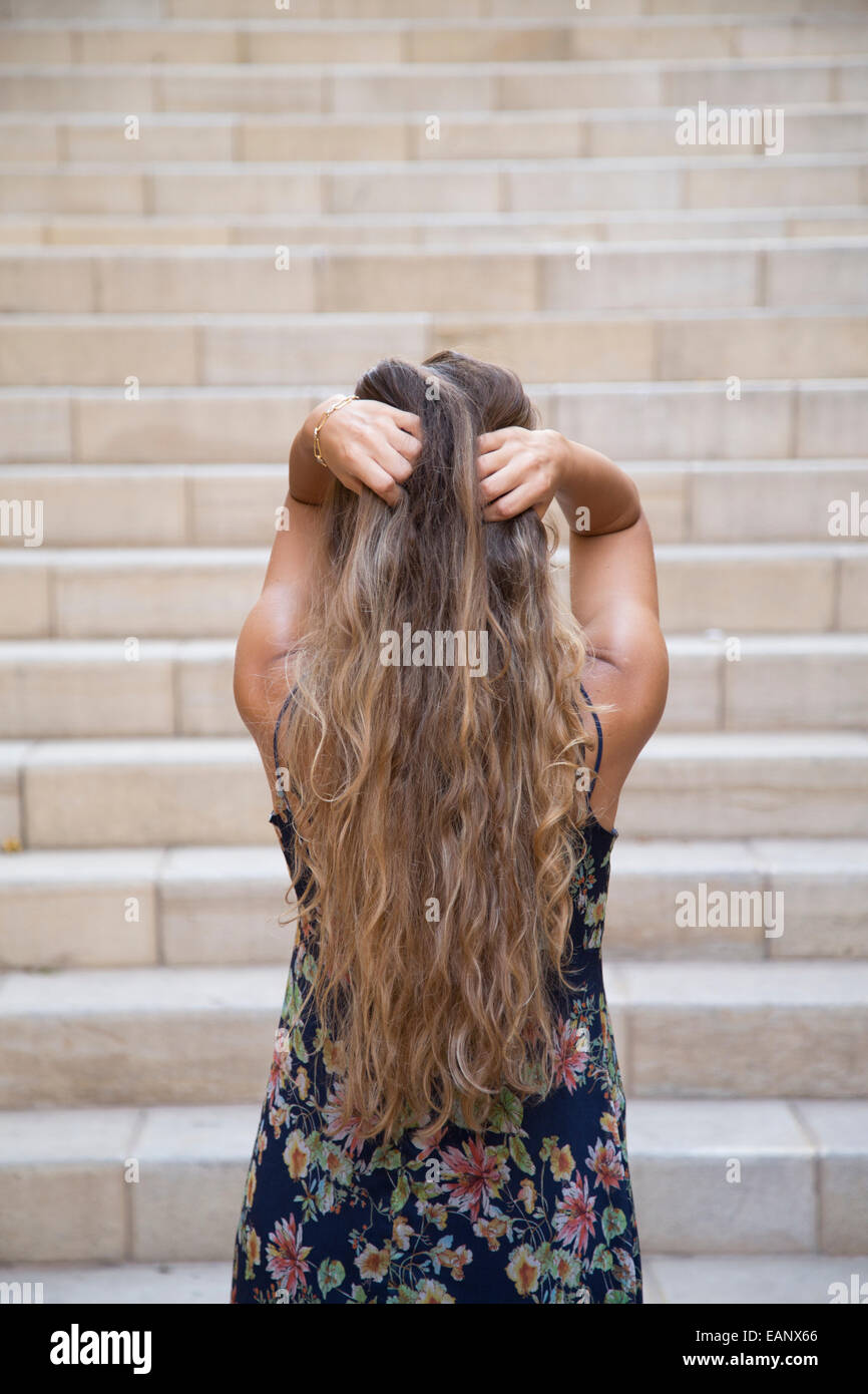 Young woman head in hands Stock Photo - Alamy