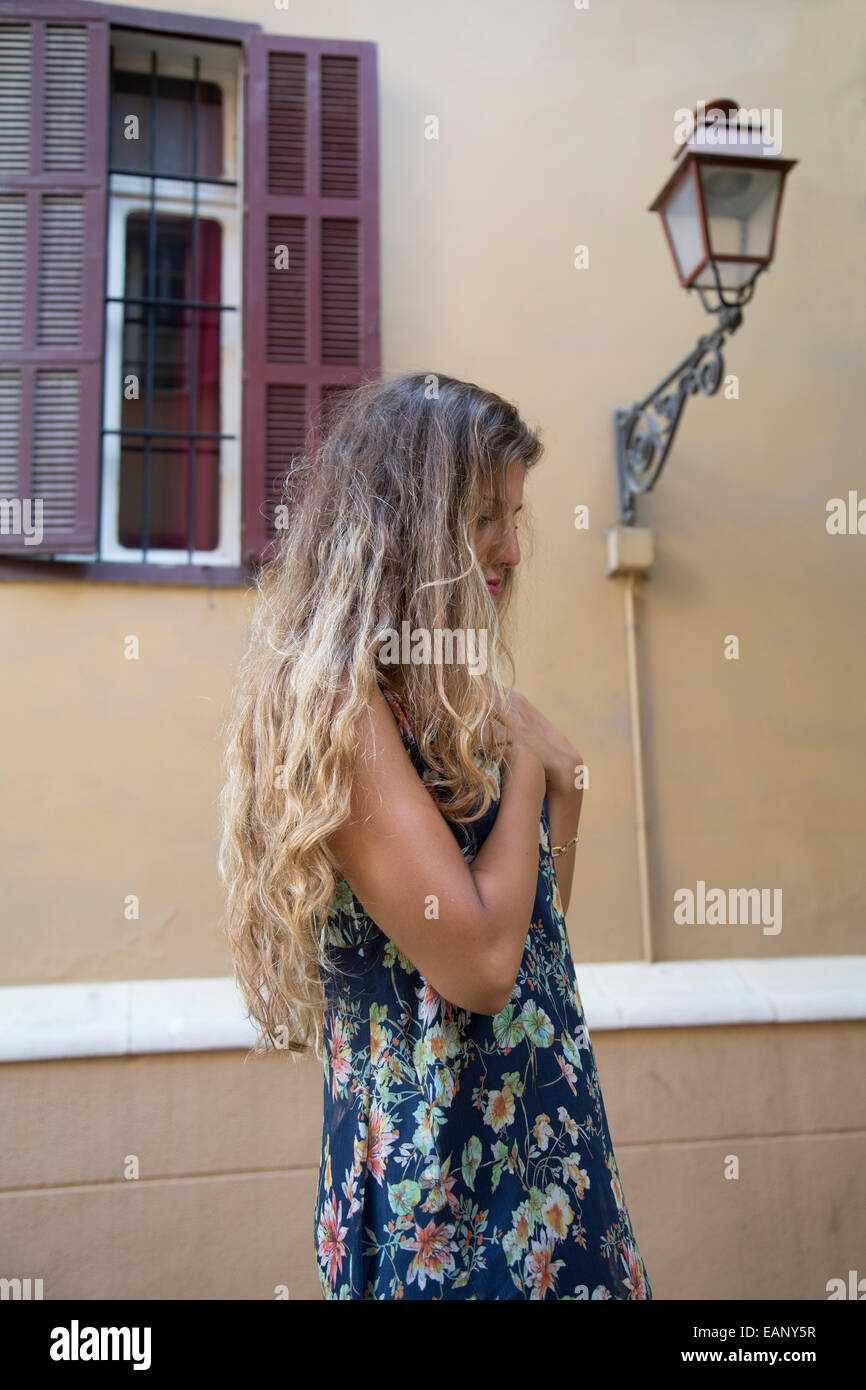 Young woman hands over heart Stock Photo - Alamy