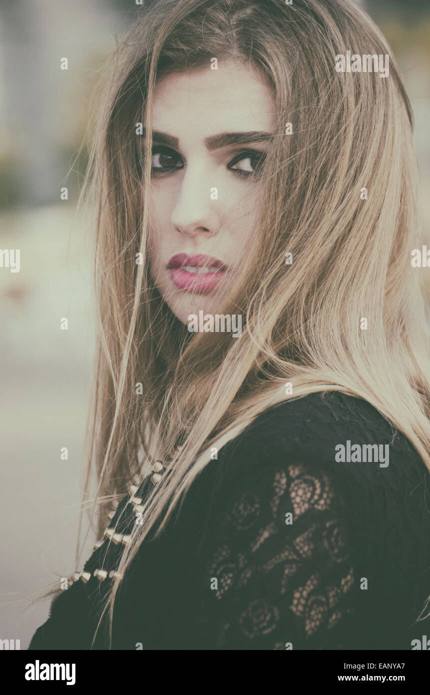 Frightened young woman outdoors Stock Photo - Alamy